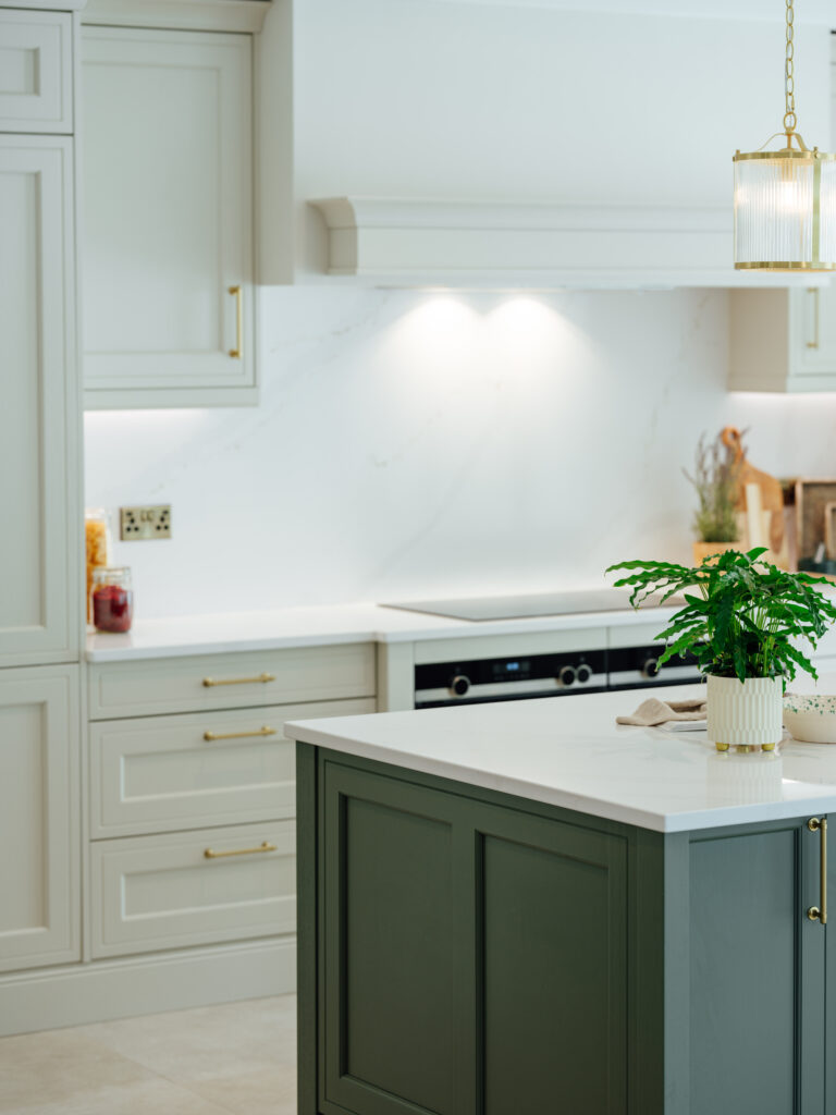 An emerald isle, in Pedmore. Green kitchen islands by The Gallery