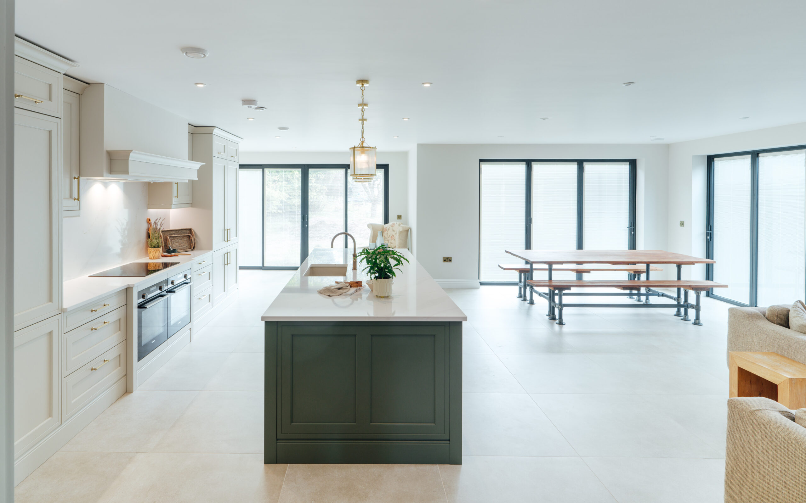 An emerald isle, in Pedmore. Green kitchen islands by The Gallery